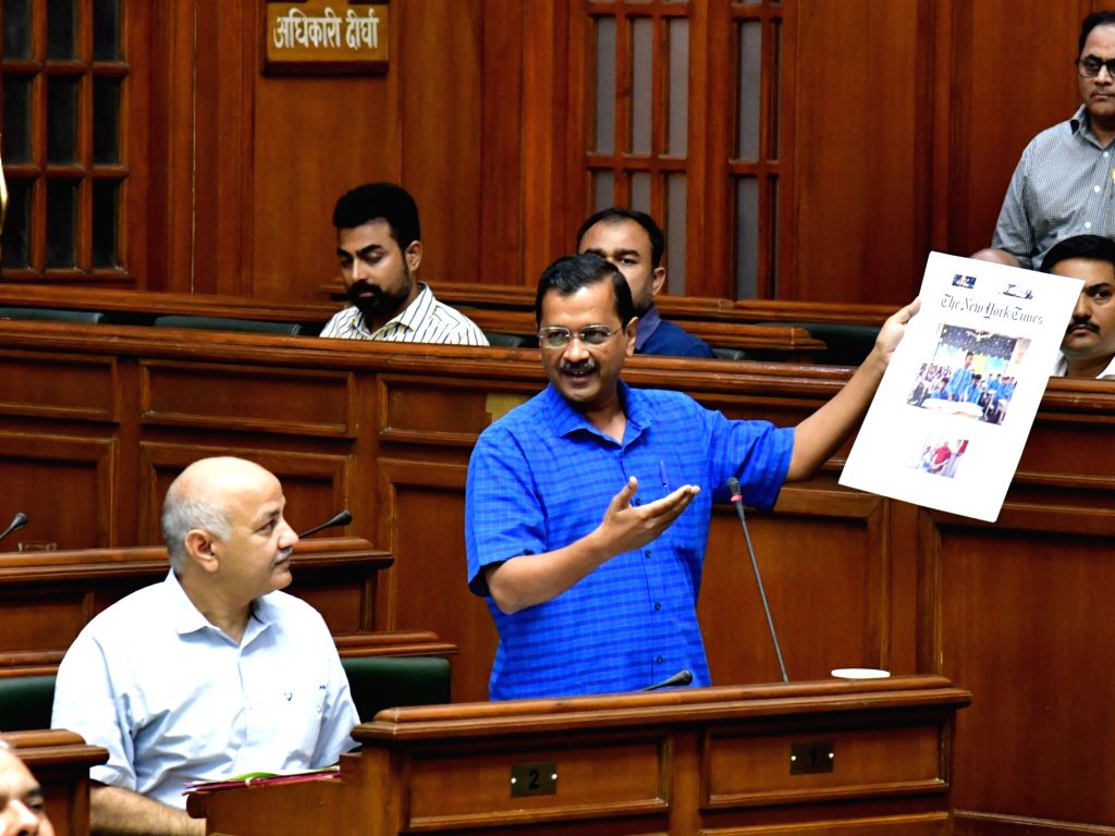 Delhi CM Arvind Kejriwal shows an article by New York Times during the ...