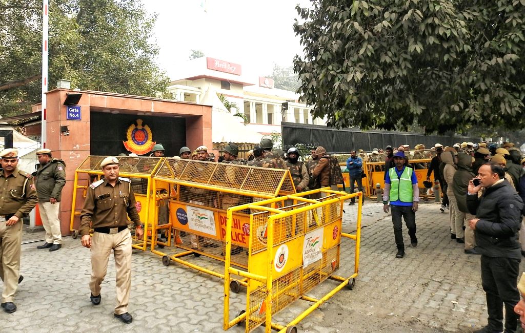 Delhi Police personnel stand guard outside Police Headquarter