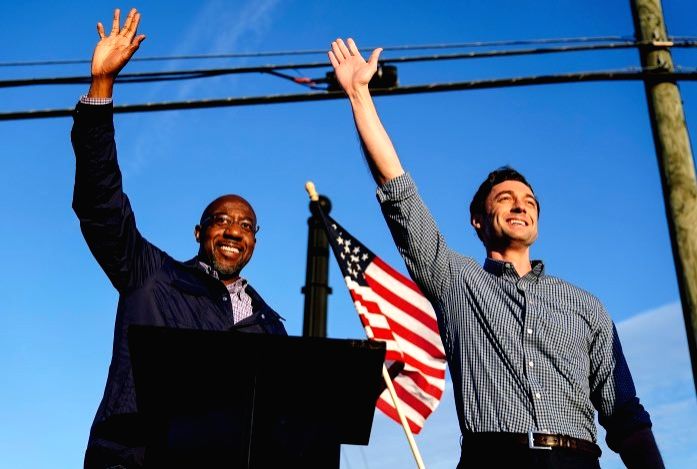 Democrats win 1 Senate seat in Georgia, lead in another