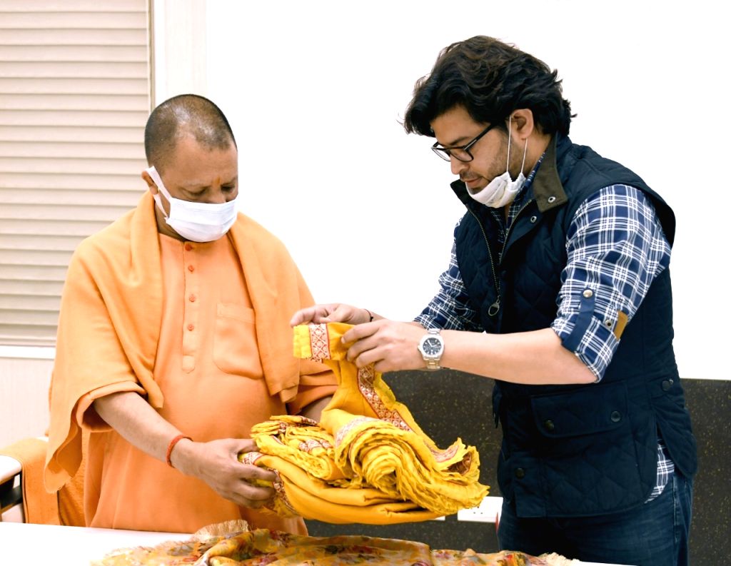 Free Photo: Designer Manish Tripathi with Yogi, showing him new clothes ...