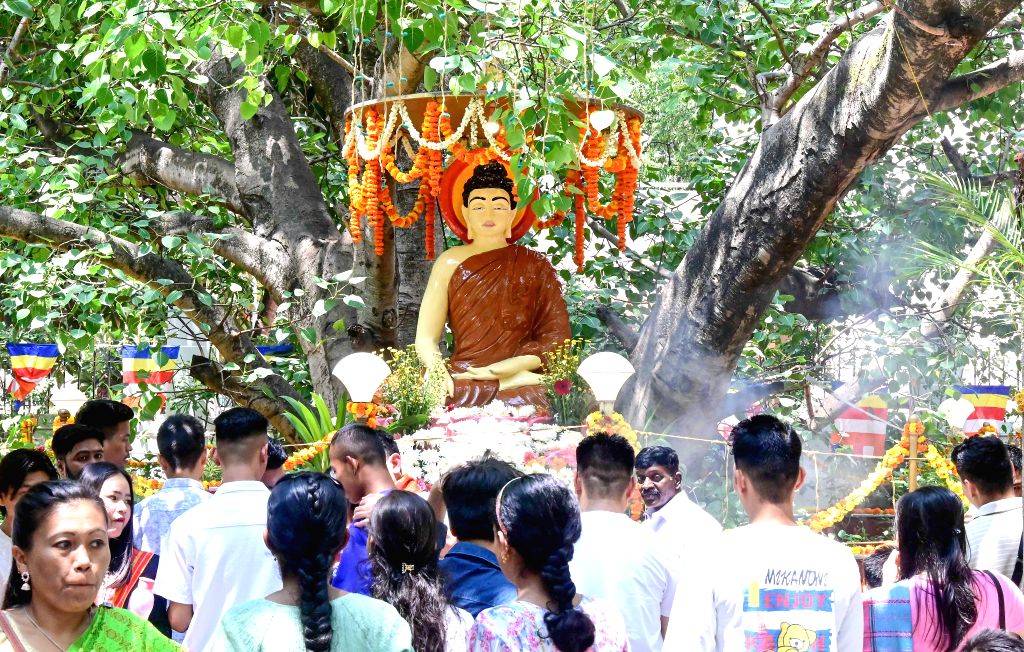 Devotees and monks observe Buddha Purnima