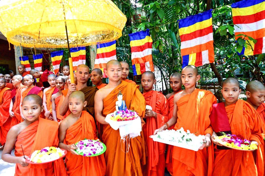Devotees and monks observe Buddha Purnima