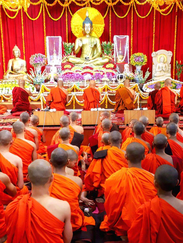 Devotees and monks observe Buddha Purnima