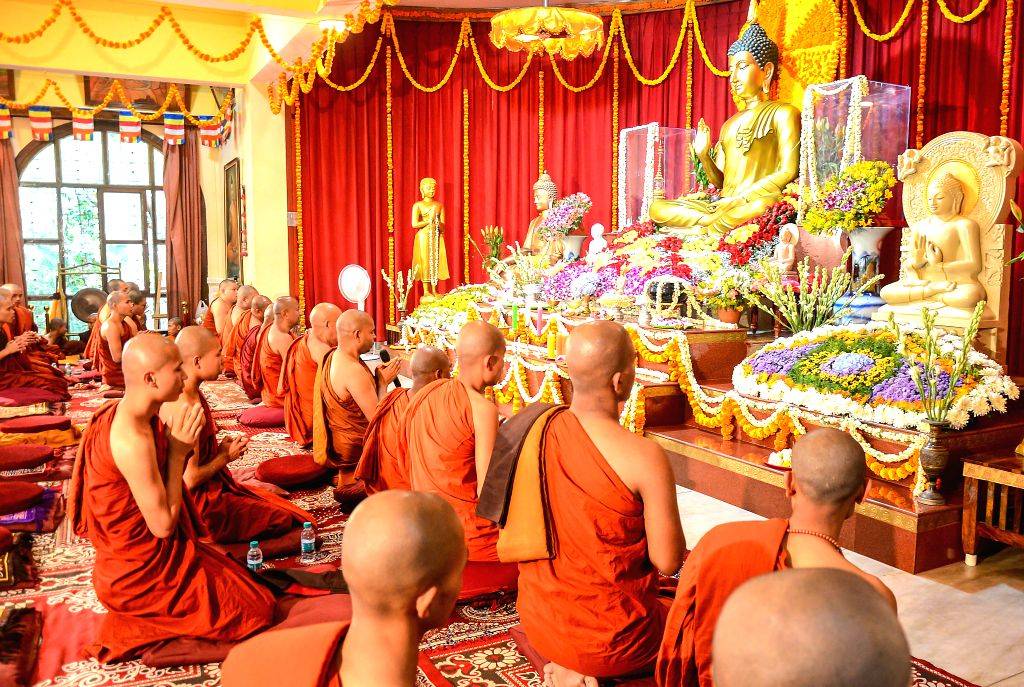 Devotees and monks observe Buddha Purnima