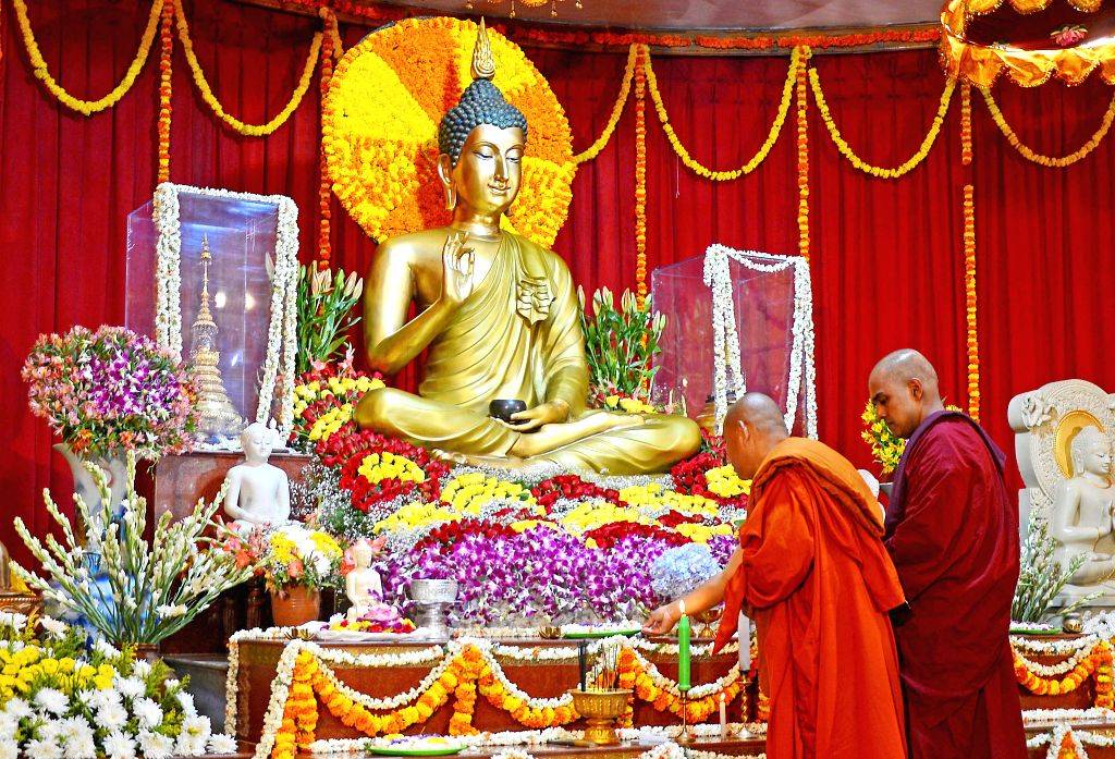Devotees and monks observe Buddha Purnima