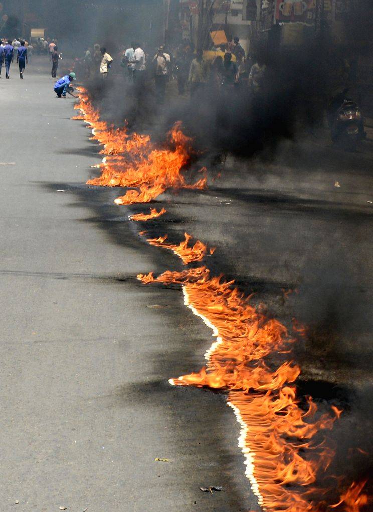 Devotees burn camphor blocks as part of a ritual during the celebration ...