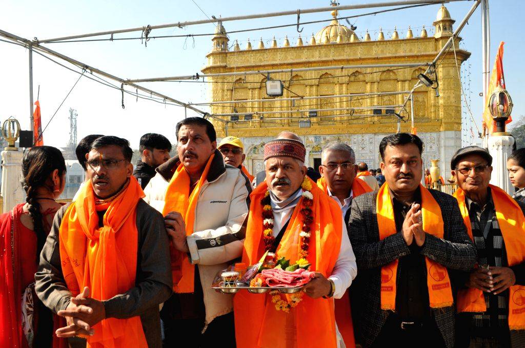 Devotees chant religious slogans before leaving for a pilgrimage to Sri ...