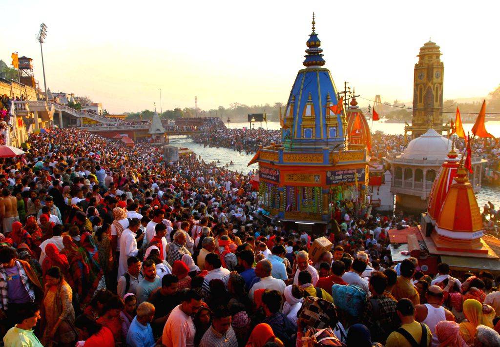 Devotees gather to take a holy dip in the river Ganga