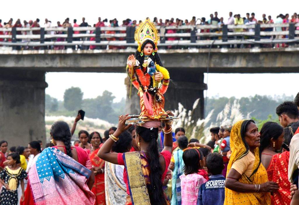 Devotees immerse idols during Purulia Loko Utsob