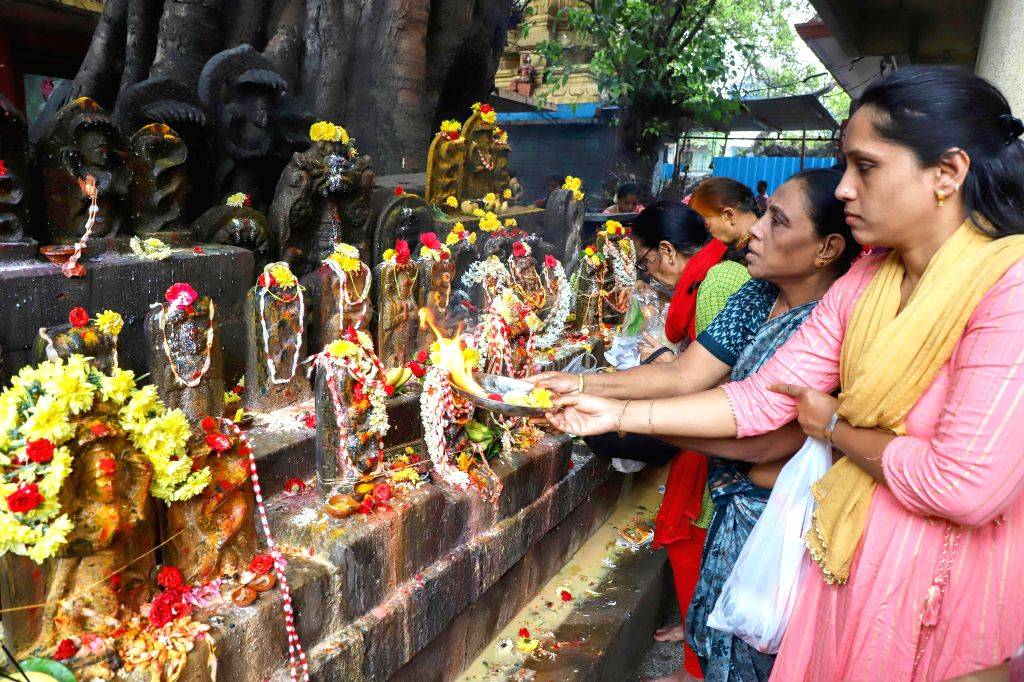 Devotees offer prayers on the occasion of 'Naga Panchami' festival at ...