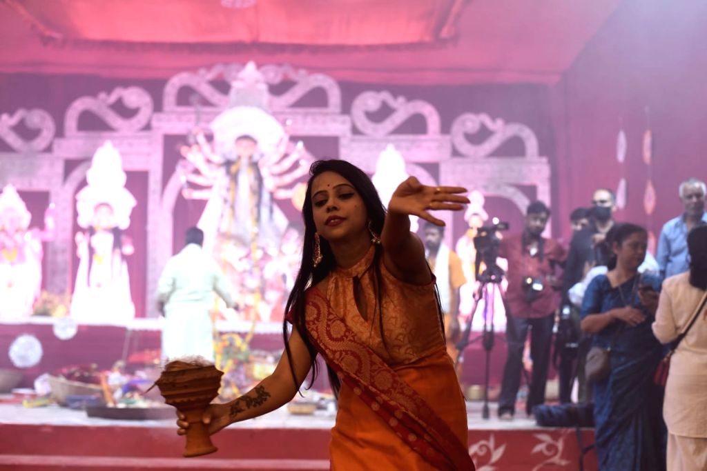 Free Photo : Devotees perform 'Dhunuchi' dance during Durga Puja ...