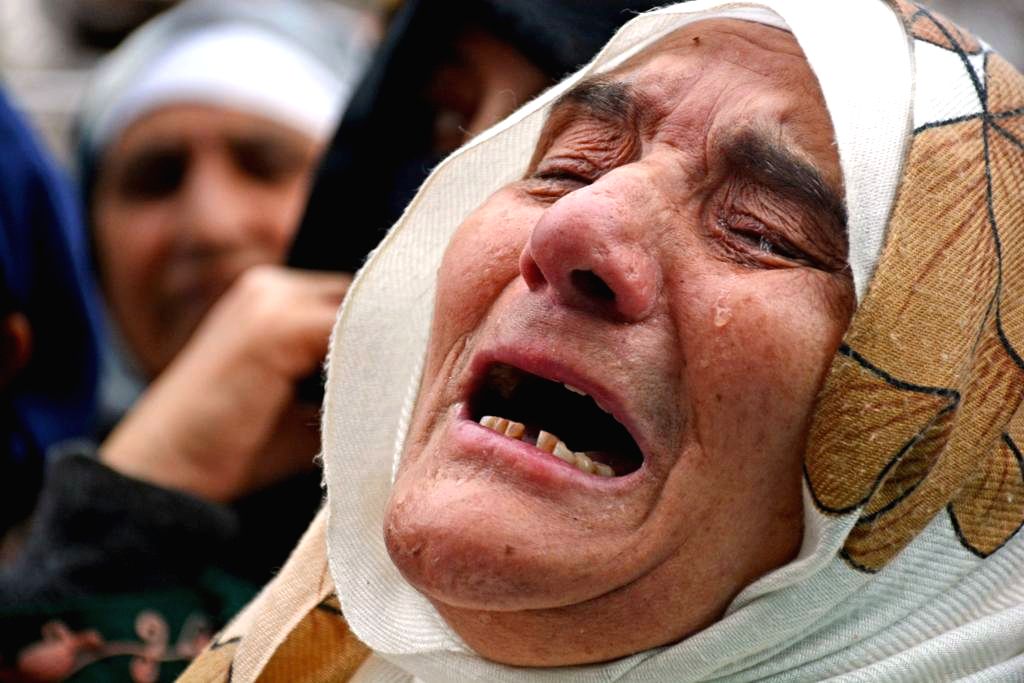 Devotees pray as head priest displays holy Relic on the occasion of ...