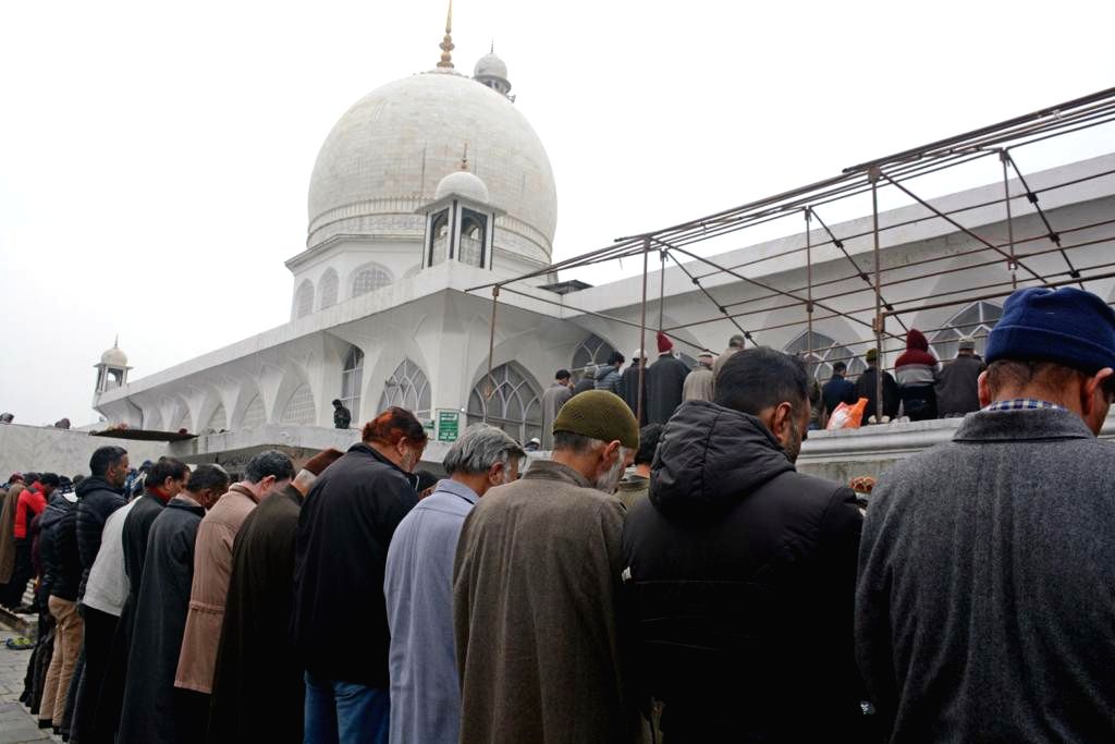 Devotees pray as head priest displays holy Relic on the occasion of ...