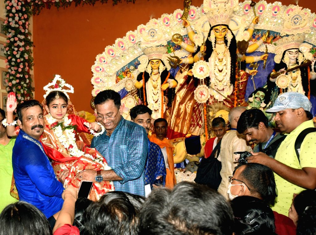 Devotees seek blessings from a girl child during 'Kumari Puja