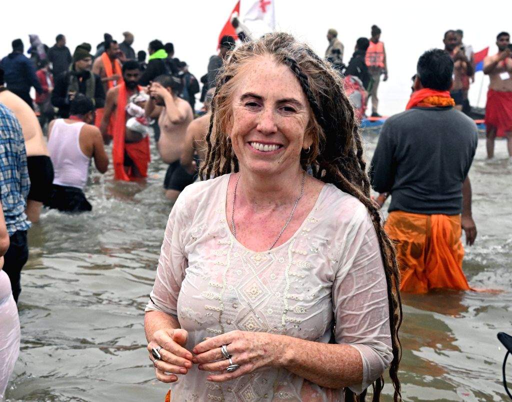 Devotees take a holy dip at the Triveni Sangam