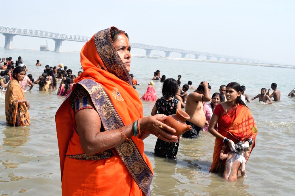 Devotees take a holy dip in the river Ganga