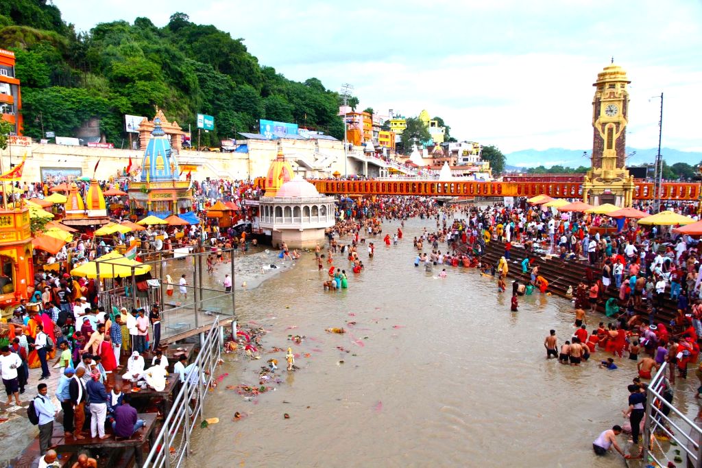 : Haridwar: Devotees take holy dip in river Ganga on Sharad Purnima, at ...