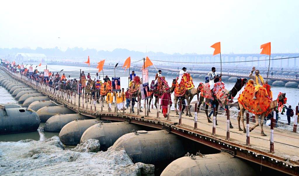 Devotees take part in a religious procession for the Maha Kumbh Mela 2025