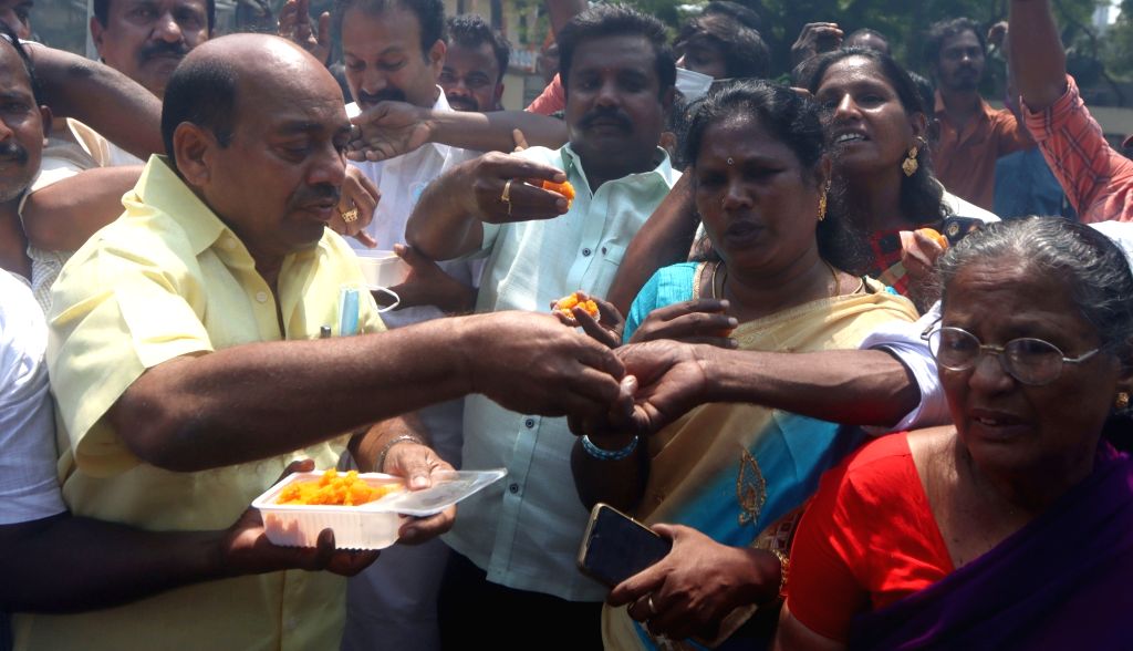 DMK party workers celebrate after the party's lead in the local body ...