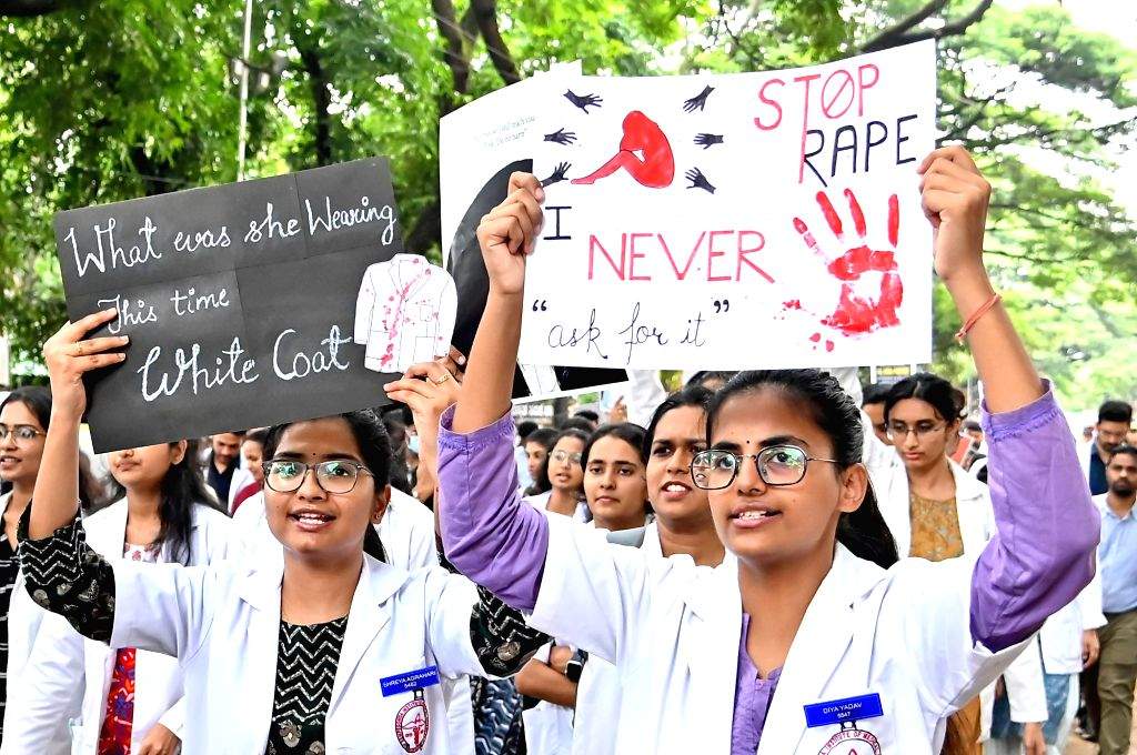 Doctors and medical students stage a protest against the rape and ...