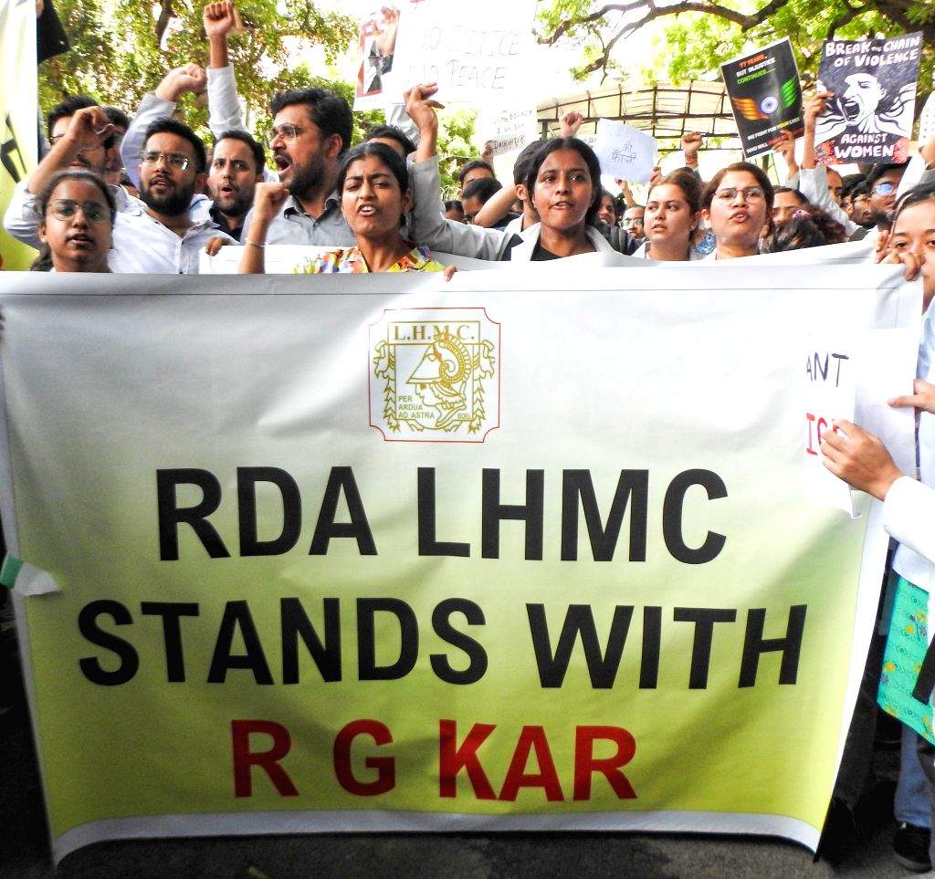 Doctors stage a protest against the rape and murder of a young medic at ...