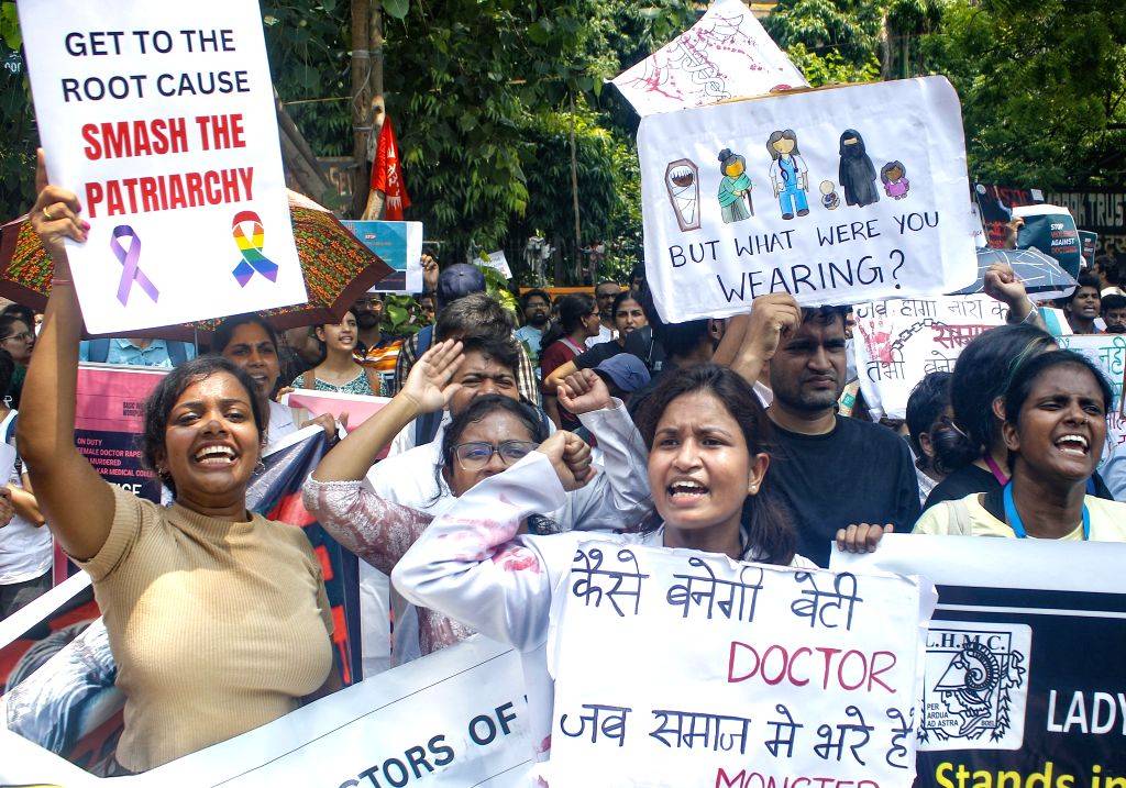 Doctors stage a protest over the rape and murder of a trainee doctor at ...