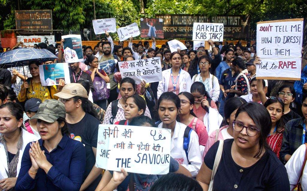 Doctors stage a protest over the rape and murder of a trainee doctor at ...