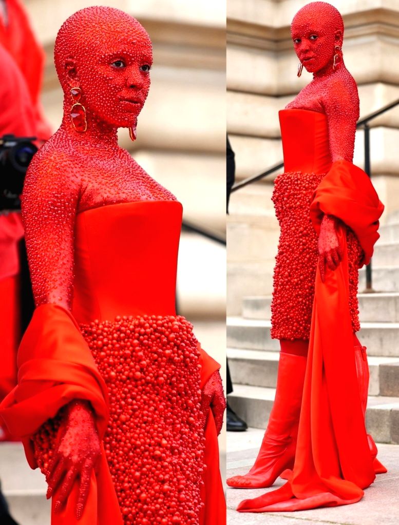 Doja Cat covered in red paint & 30,000 crystals for Paris Fashion Week