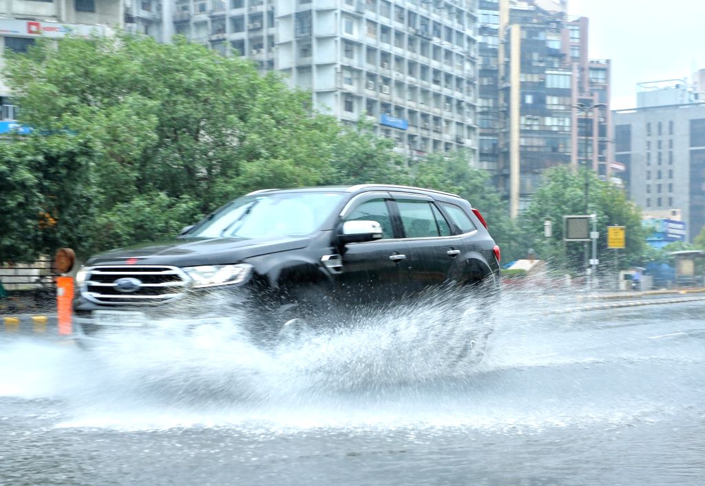 : Driving Vehicles on road during the rainy day in new Delhi on ...