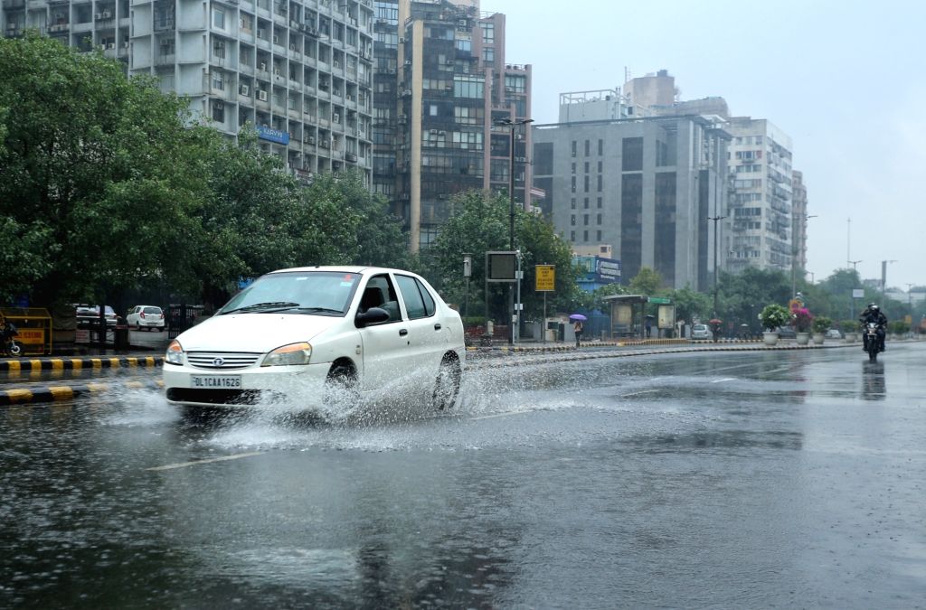 : Driving Vehicles on road during the rainy day in new Delhi on ...