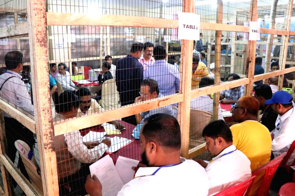 : Agartala: Election officials tally votes at a counting hall