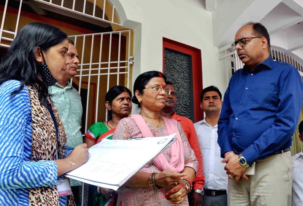 Enumerator staff collect information from residents for a caste-based ...