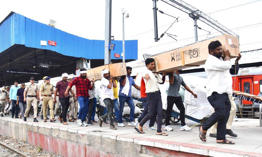 Family members and police personnel carry mortal remains of four Jaipur ...