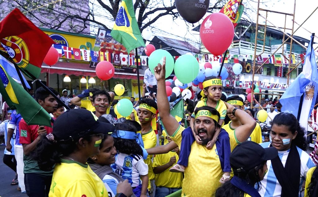 Fans of Brazil and Argentina wearing team jerseys.