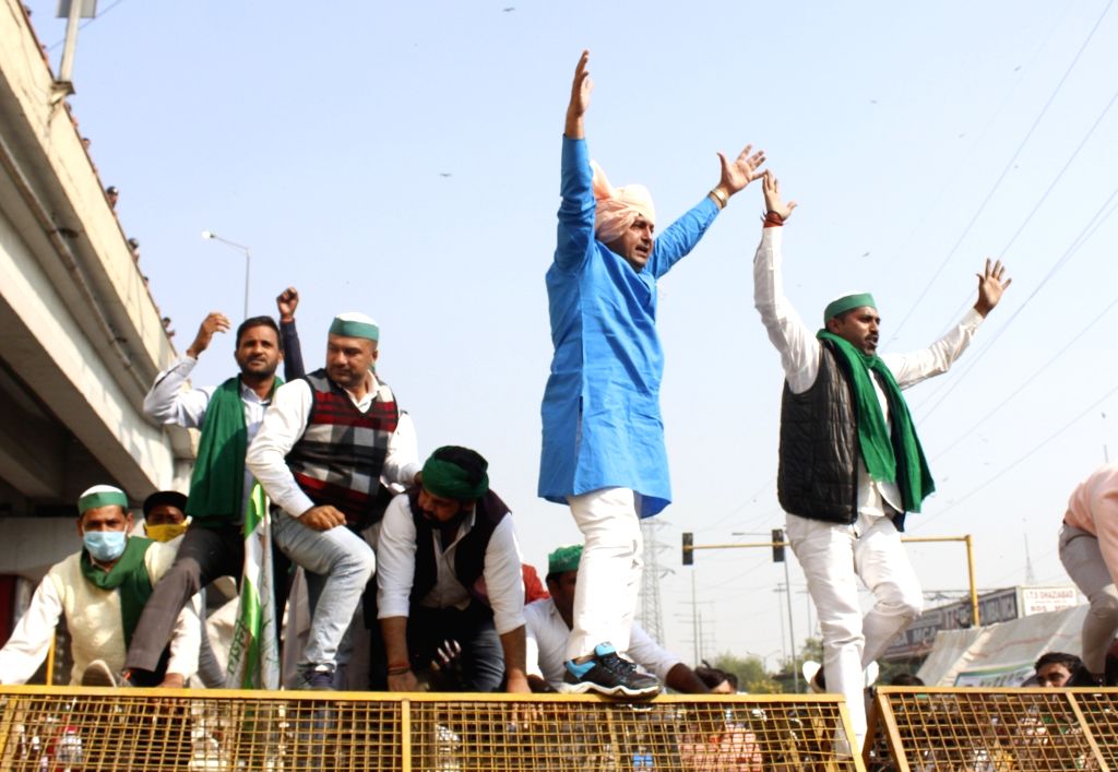 Farmers dig in heels, continue to rally on Delhi borders as more join in