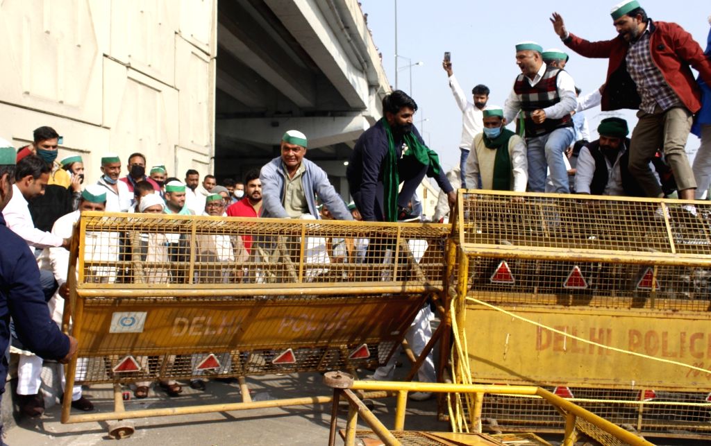 Farmers dig in heels, continue to rally on Delhi borders as more join in