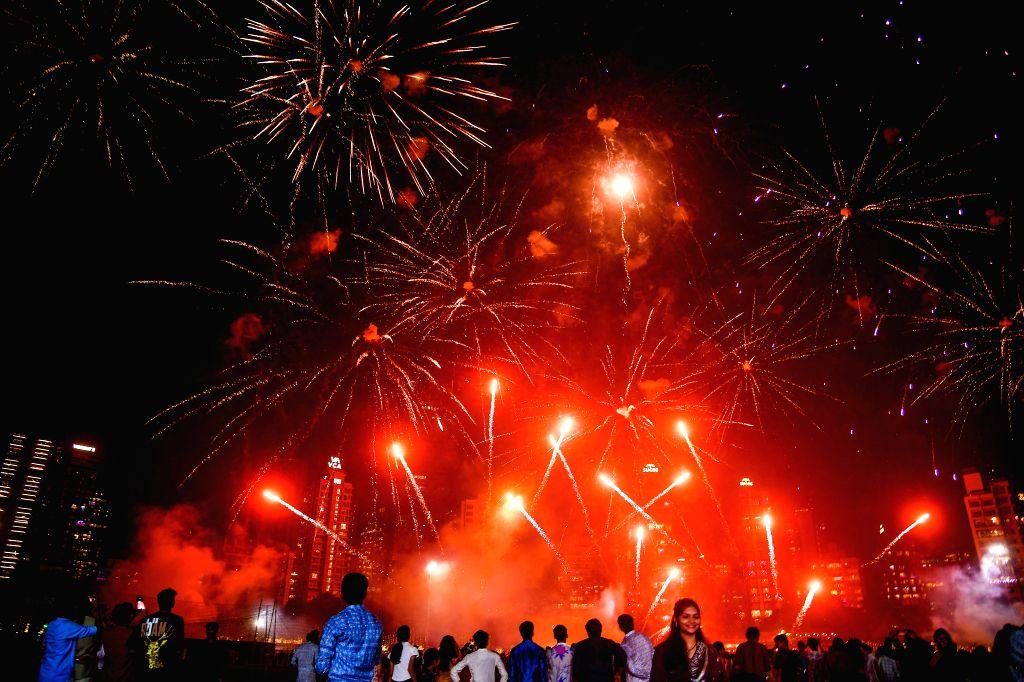Fireworks dazzle the sky as people celebrate Diwali in Mumbai