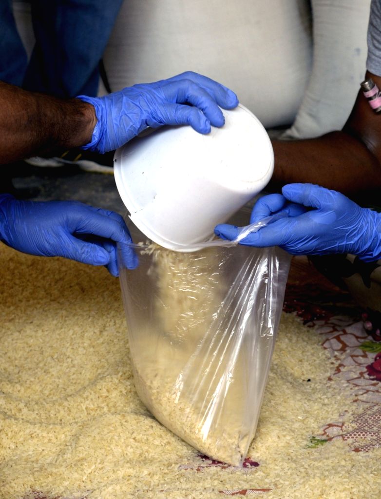 Food packets being prepared to be distributed among poor during lockdown