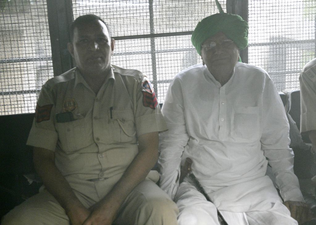 Former Haryana CM Om Prakash Chautala being taken to jail