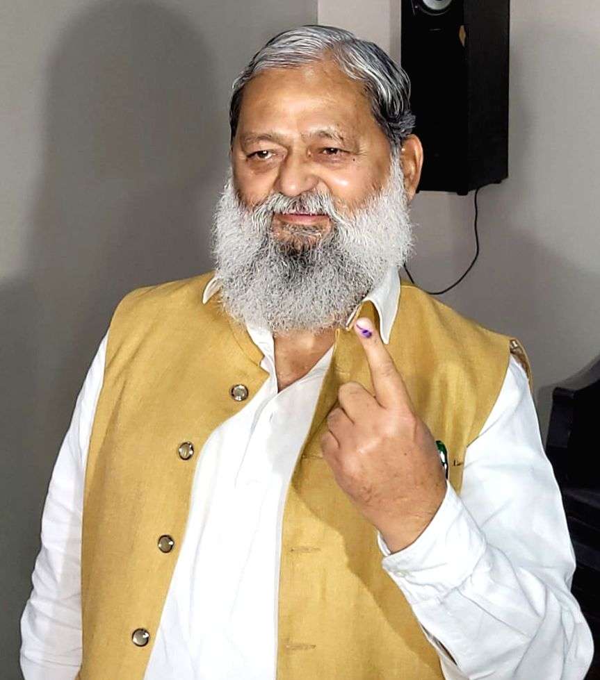 Former Home Minister of Haryana Anil Vij shows his inked inger after ...