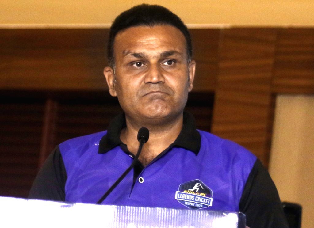 Former Indian cricketer Virender Sehwag speaks during the curtain raiser
