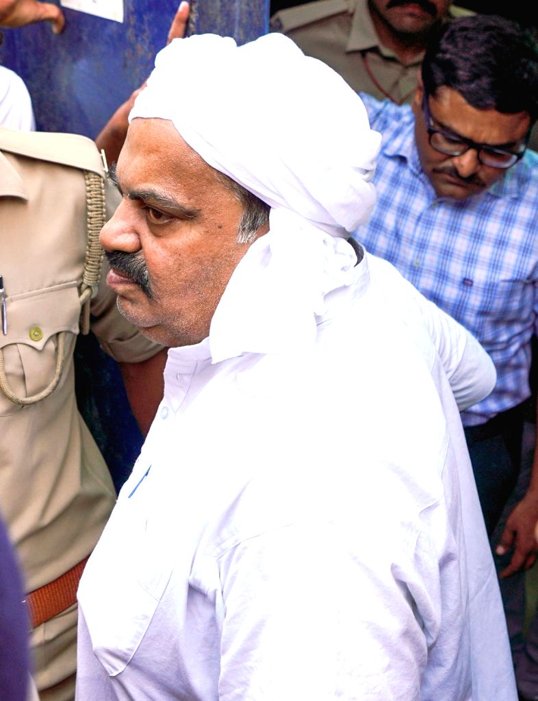 Gangster-turned-politician Atiq Ahmed being brought from Sabarmati ...