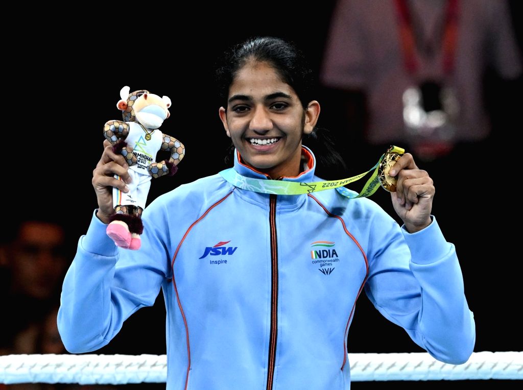 Gold medalist India's Nitu Ghanghas pose with the medal