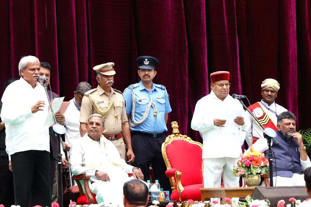 Governor of Karnataka Thawar Chand Gehlot administers oath to the newly ...