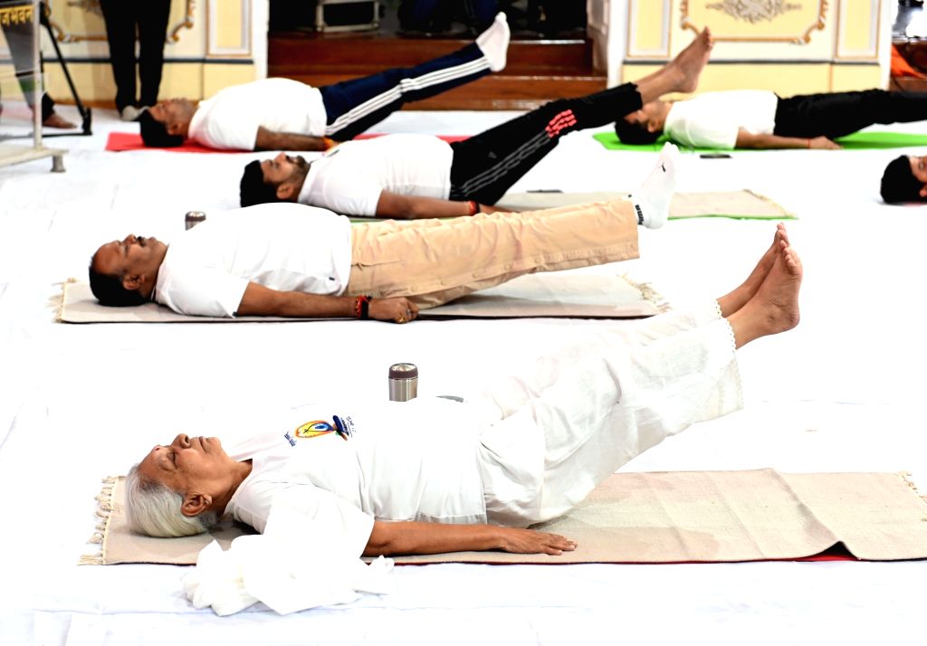 Governor of Uttar Pradesh Anandiben Patel performs yoga during a ...