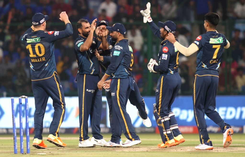 GT bowler Mohammed Shami along with teammates celebrate a dismissal