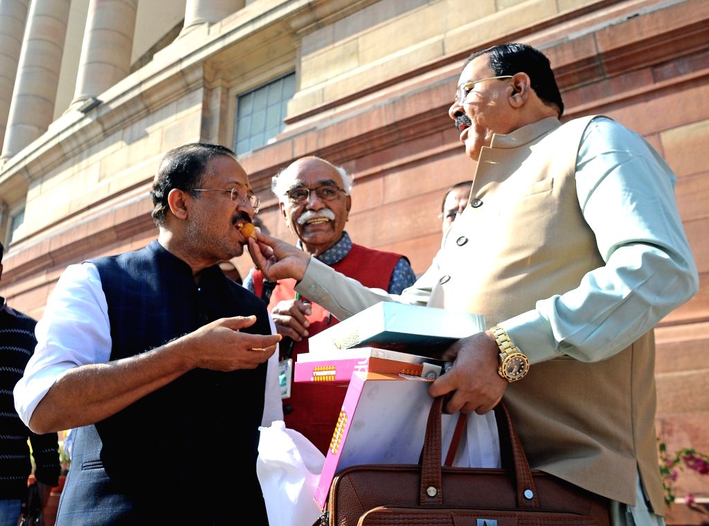 Gujarat MP offers sweets to MoS V. Muraleedharan