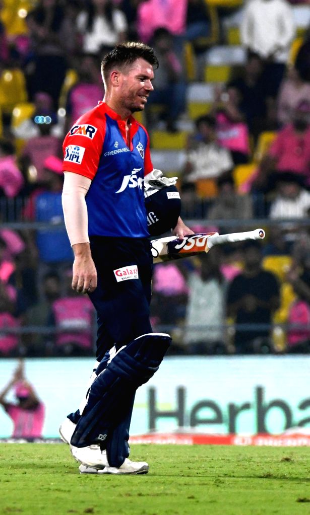 DC captain David Warner walks back after his dismissal