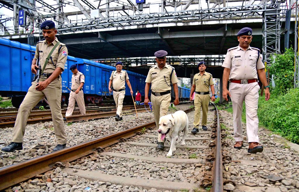 Guwahati : Police personnel inspect railway tracks with a sniffer dog ...