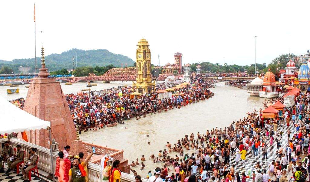 Haridwar : Kawariyas collect Ganga water at the Har Ki Pauri Ghat
